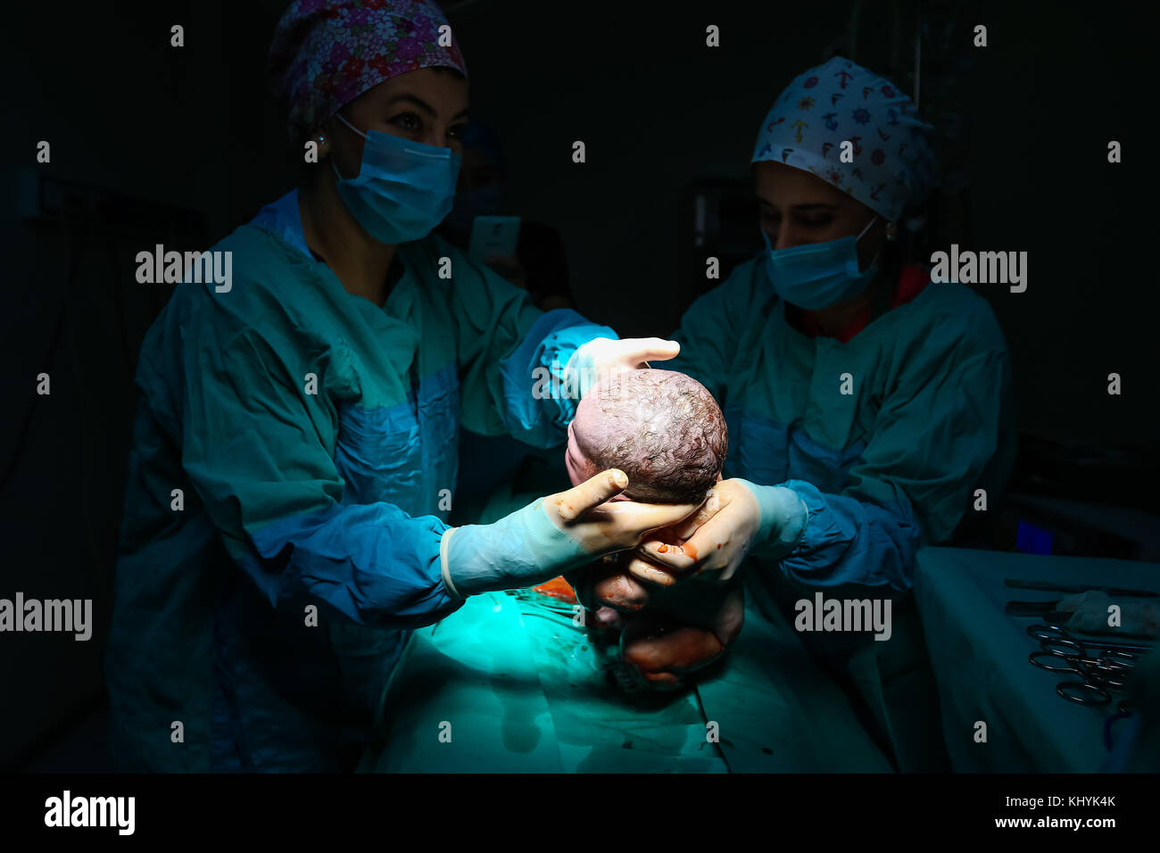Doctor holding a beautiful baby by the birth in Baku. 17.11.2017 Stock ...