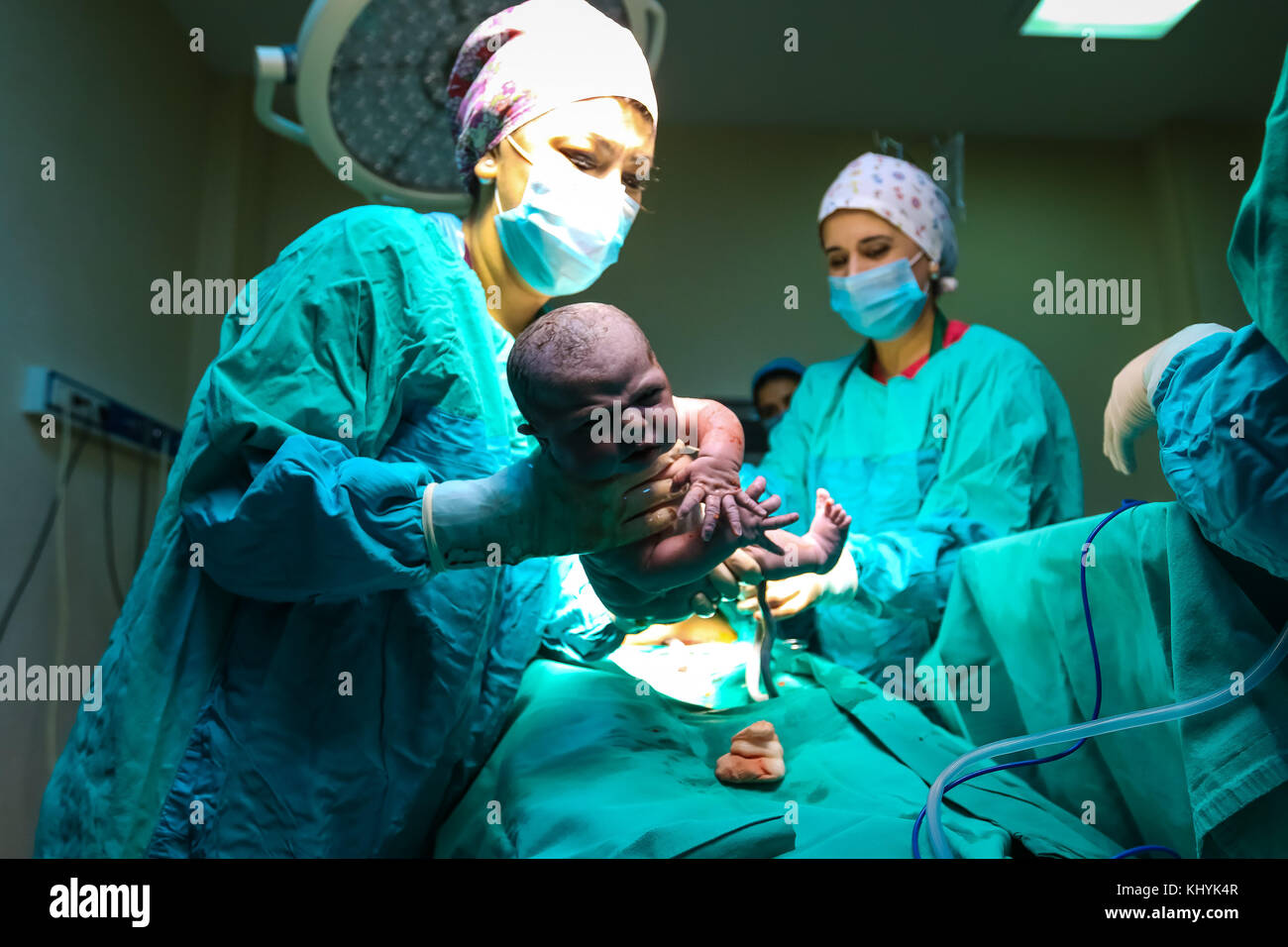 Doctor holding a beautiful baby by the birth in Baku. 17.11.2017 Stock ...