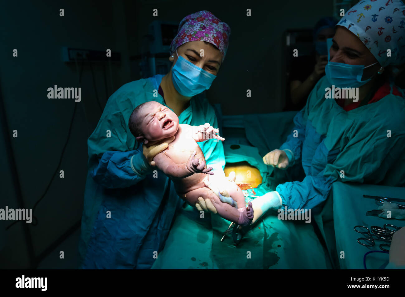Doctor holding a beautiful baby by the birth in Baku. 17.11.2017 Stock ...