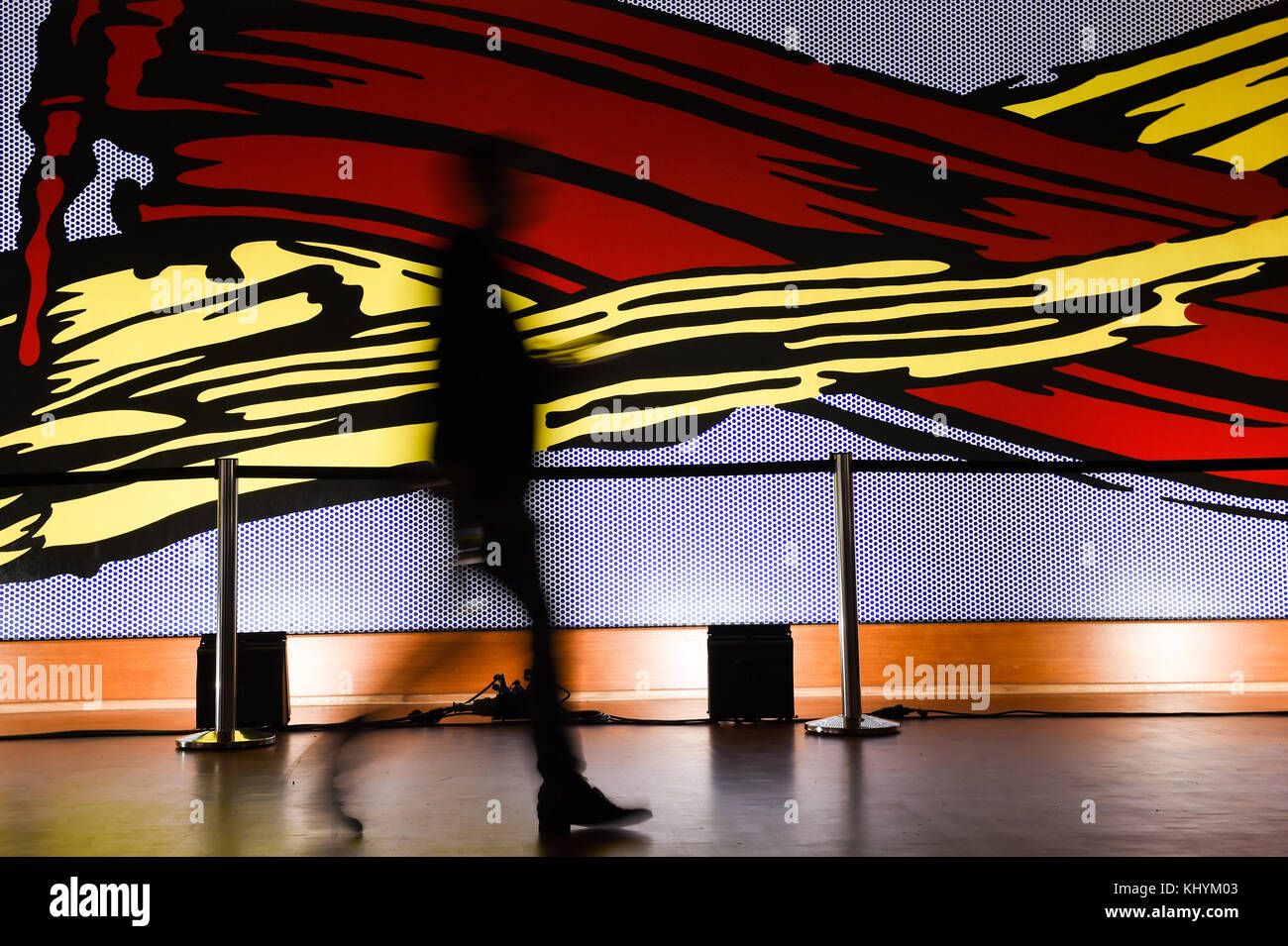 A man passes Roy Lichtenstein's mural "Brushstroke· at the Heinrich ...