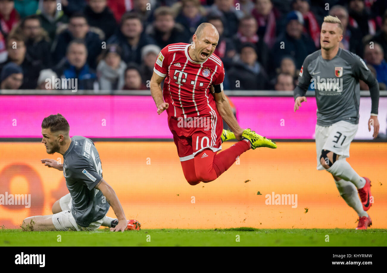 Munich's Arjen Robben and Augsburg's Philipp Max and Jeffrey Gouweleeuw ...