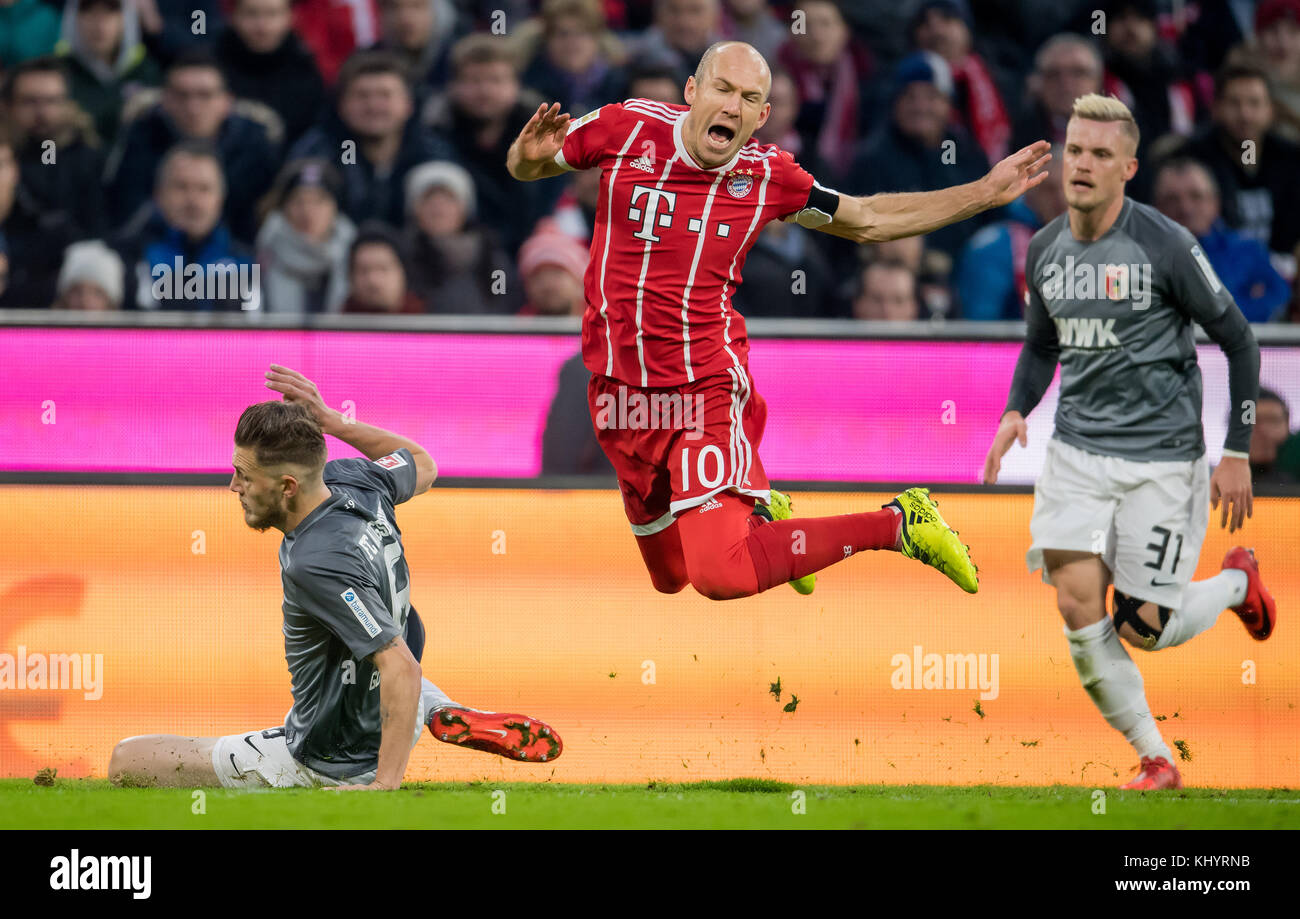 Munich's Arjen Robben and Augsburg's Philipp Max and Jeffrey Gouweleeuw ...