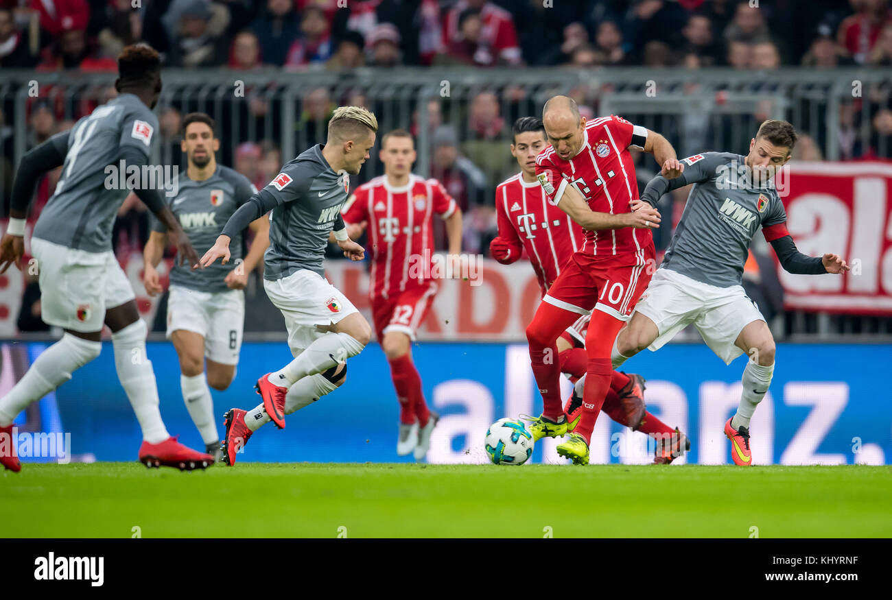 Munich's Arjen Robben and Augsburg's Philipp Max and Daniel Baier vie ...