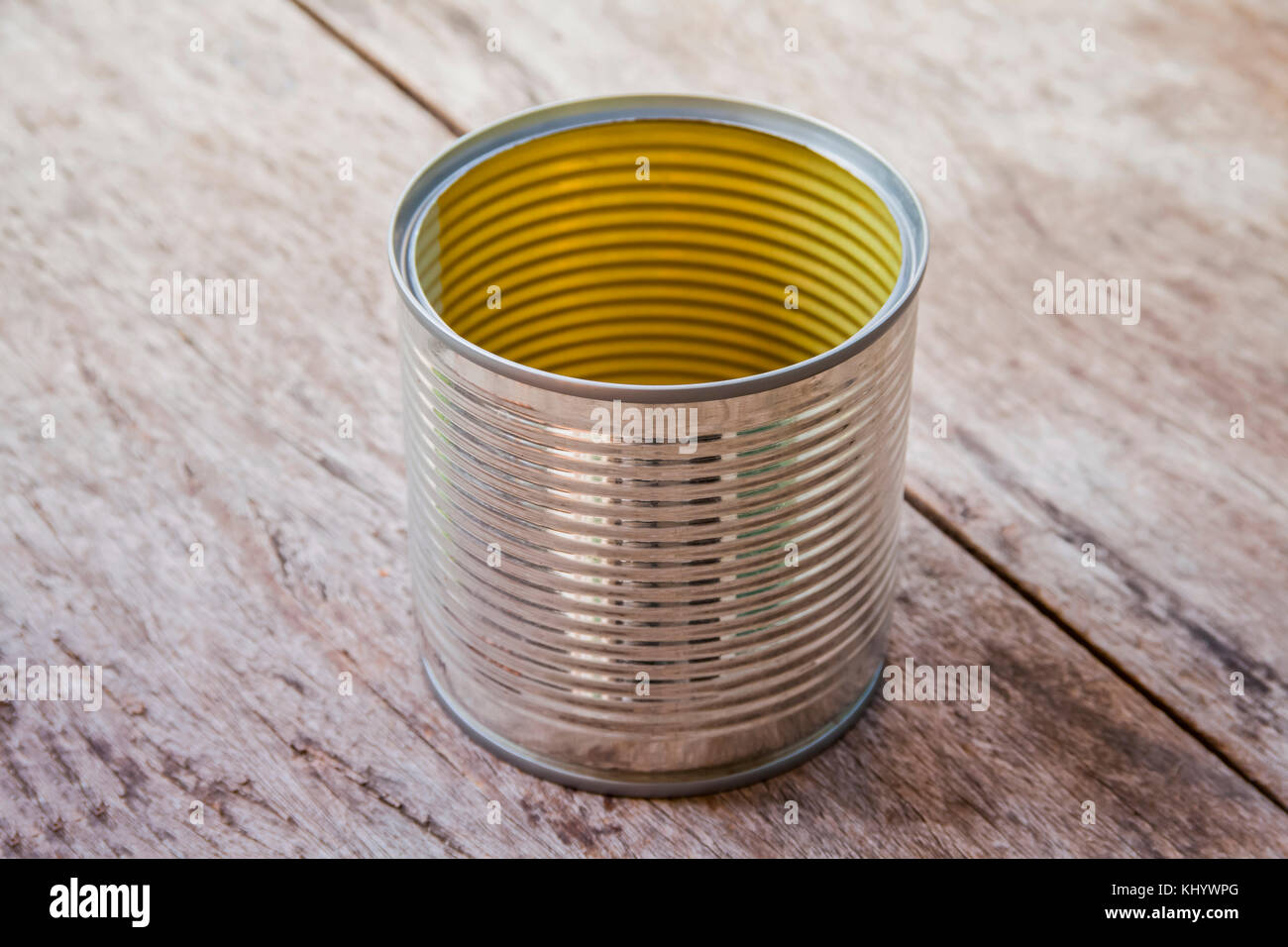 Empty canned on wood table Stock Photo - Alamy