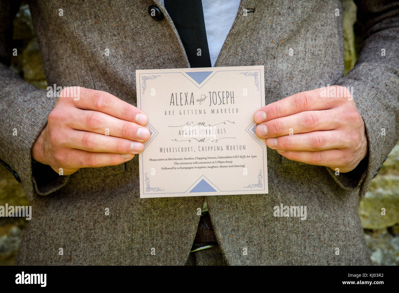 Man holding wedding invitation, mid section Stock Photo - Alamy