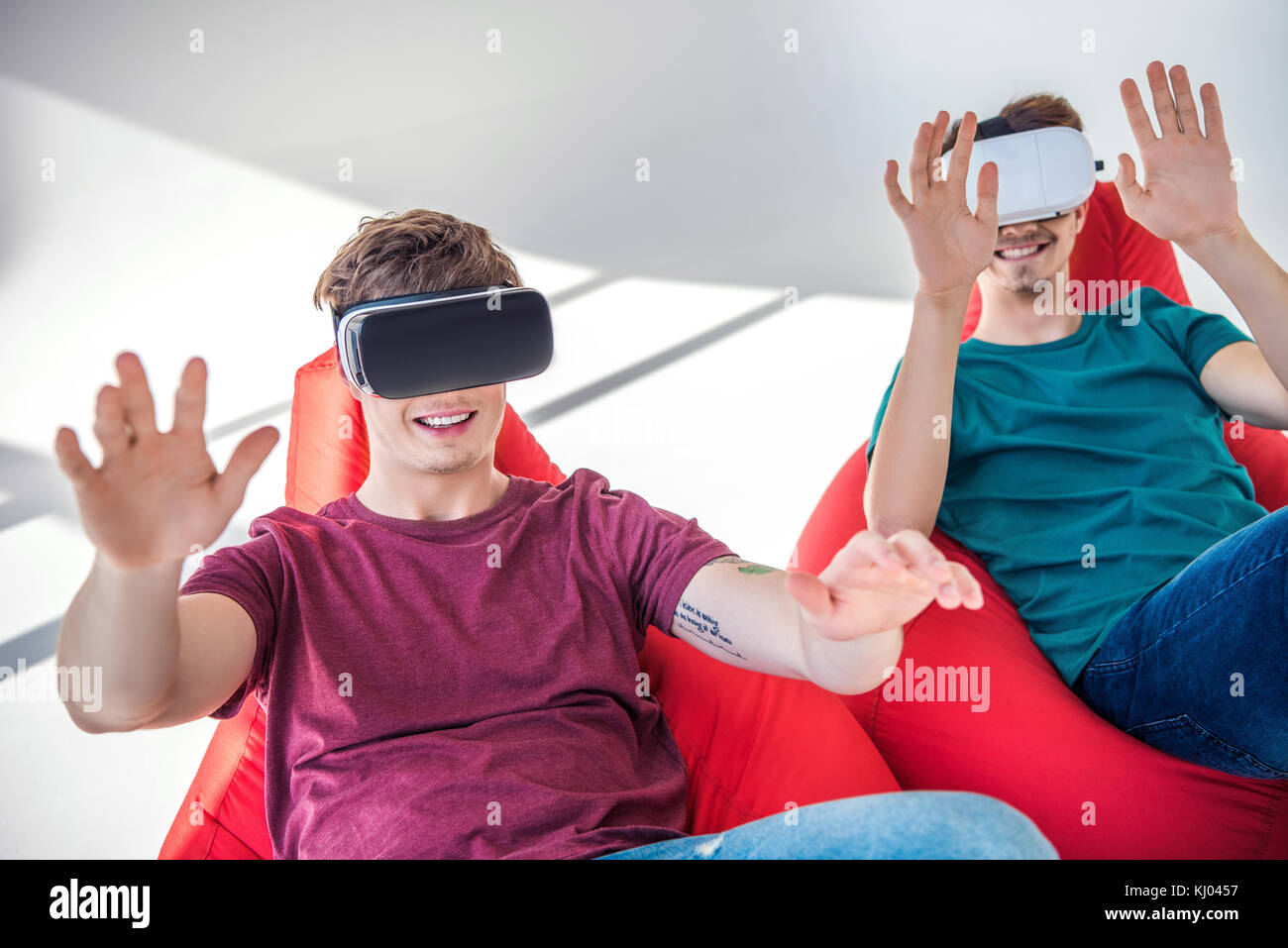 young men in vr headsets Stock Photo - Alamy