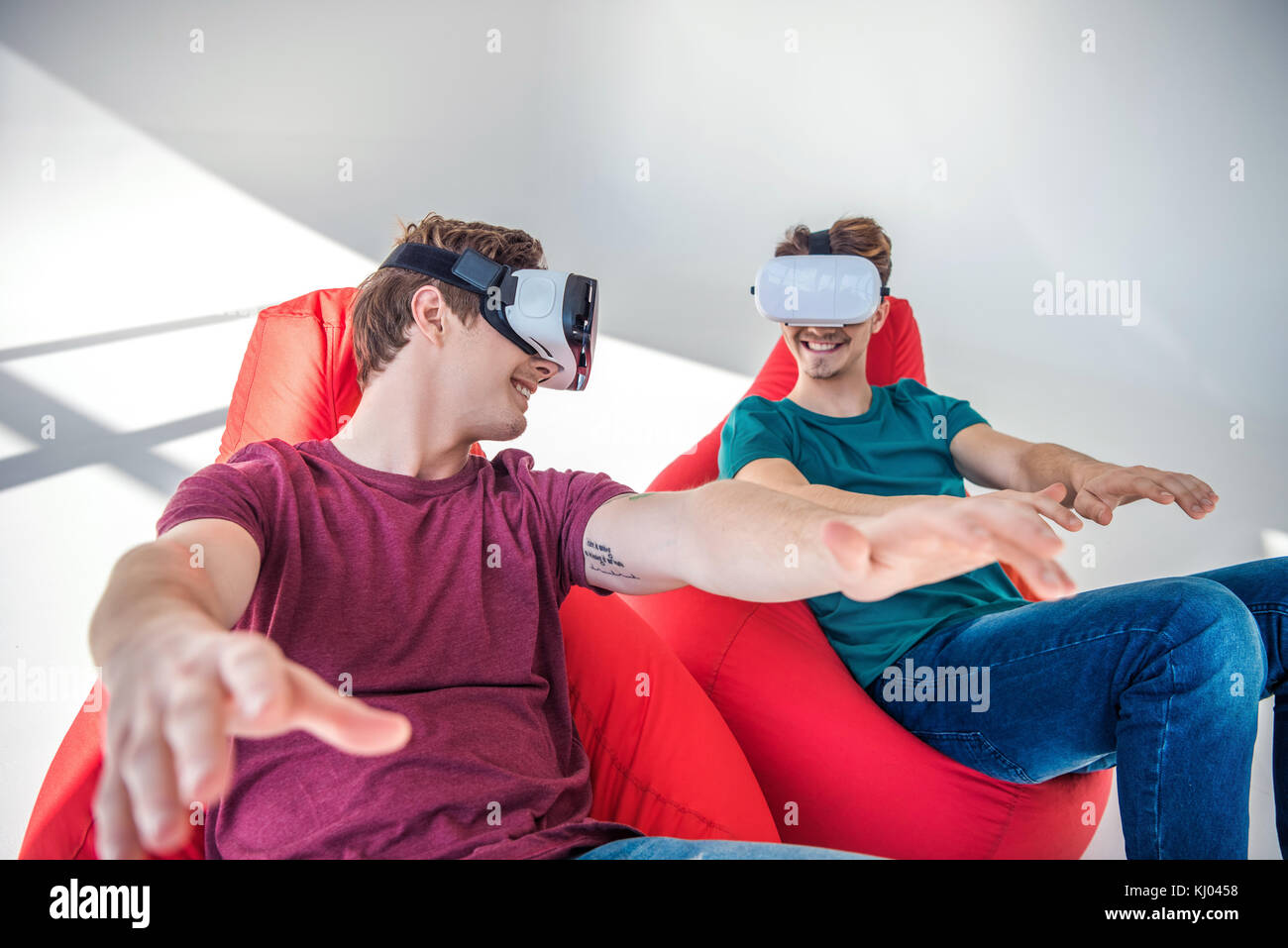 young men in vr headsets Stock Photo - Alamy
