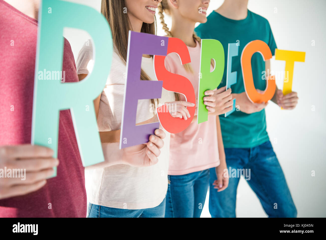 friends holding word respect Stock Photo - Alamy