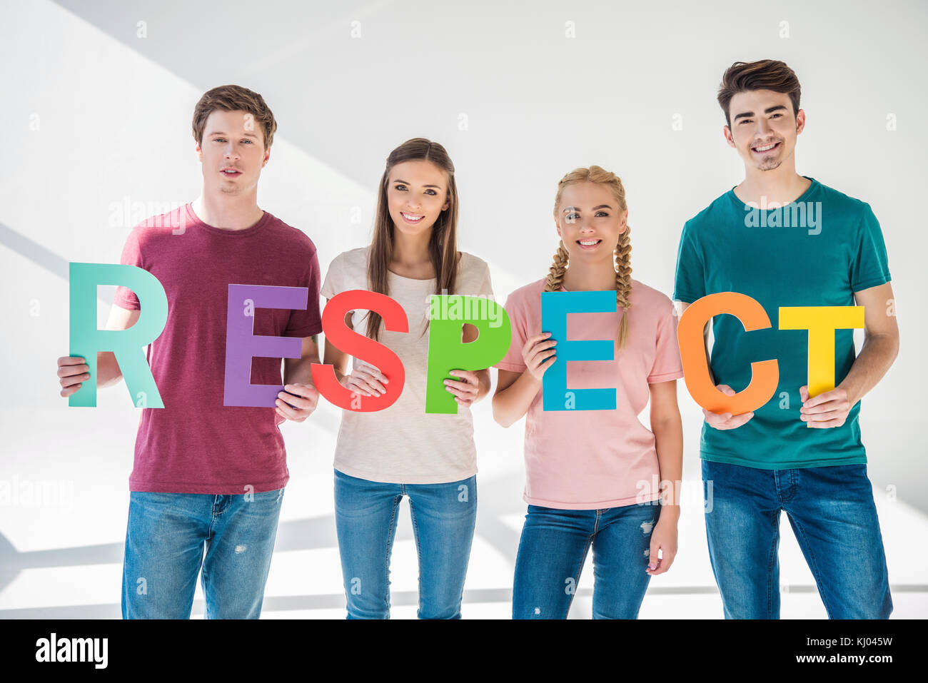 friends holding word respect Stock Photo - Alamy