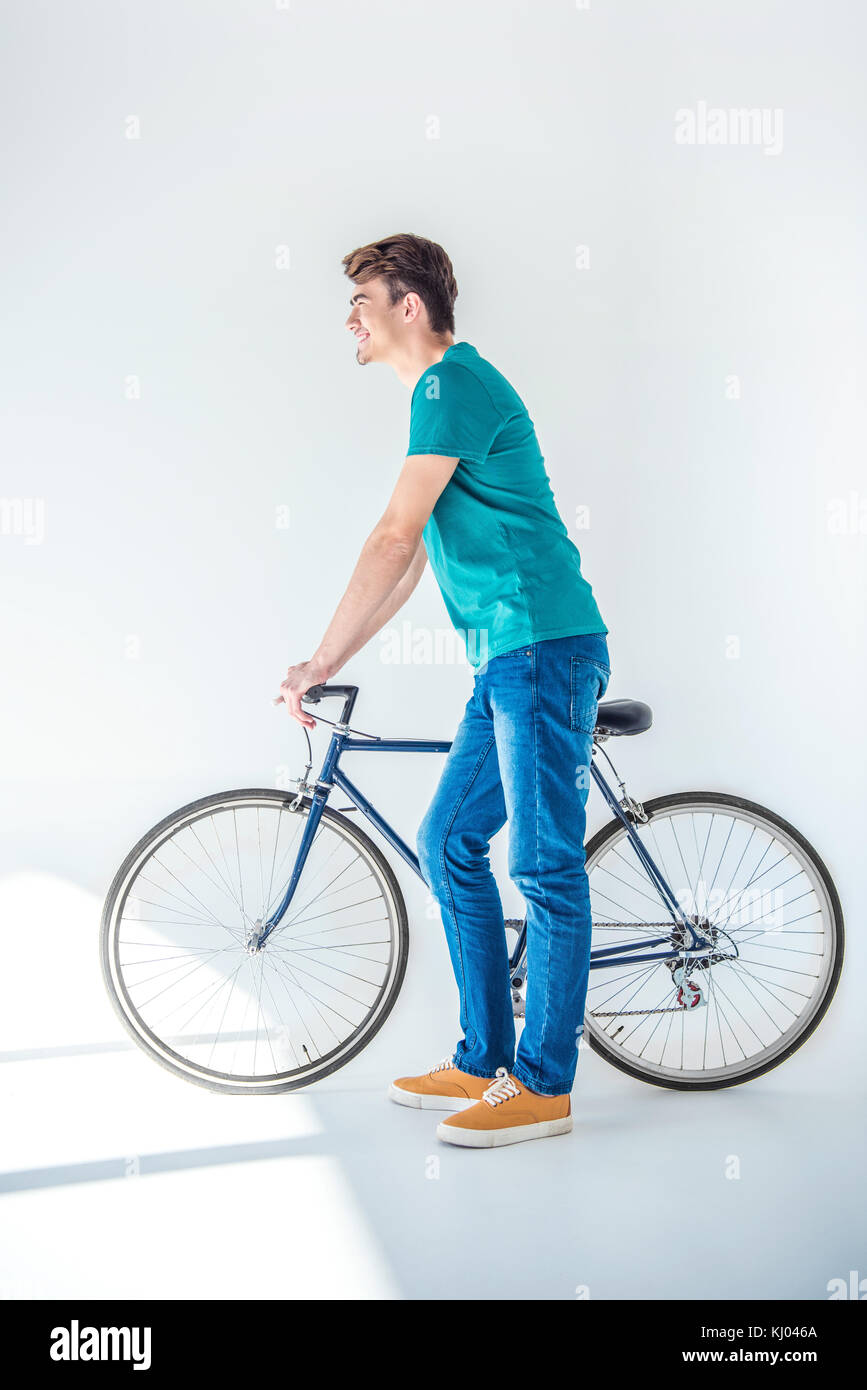 young man with bicycle Stock Photo - Alamy