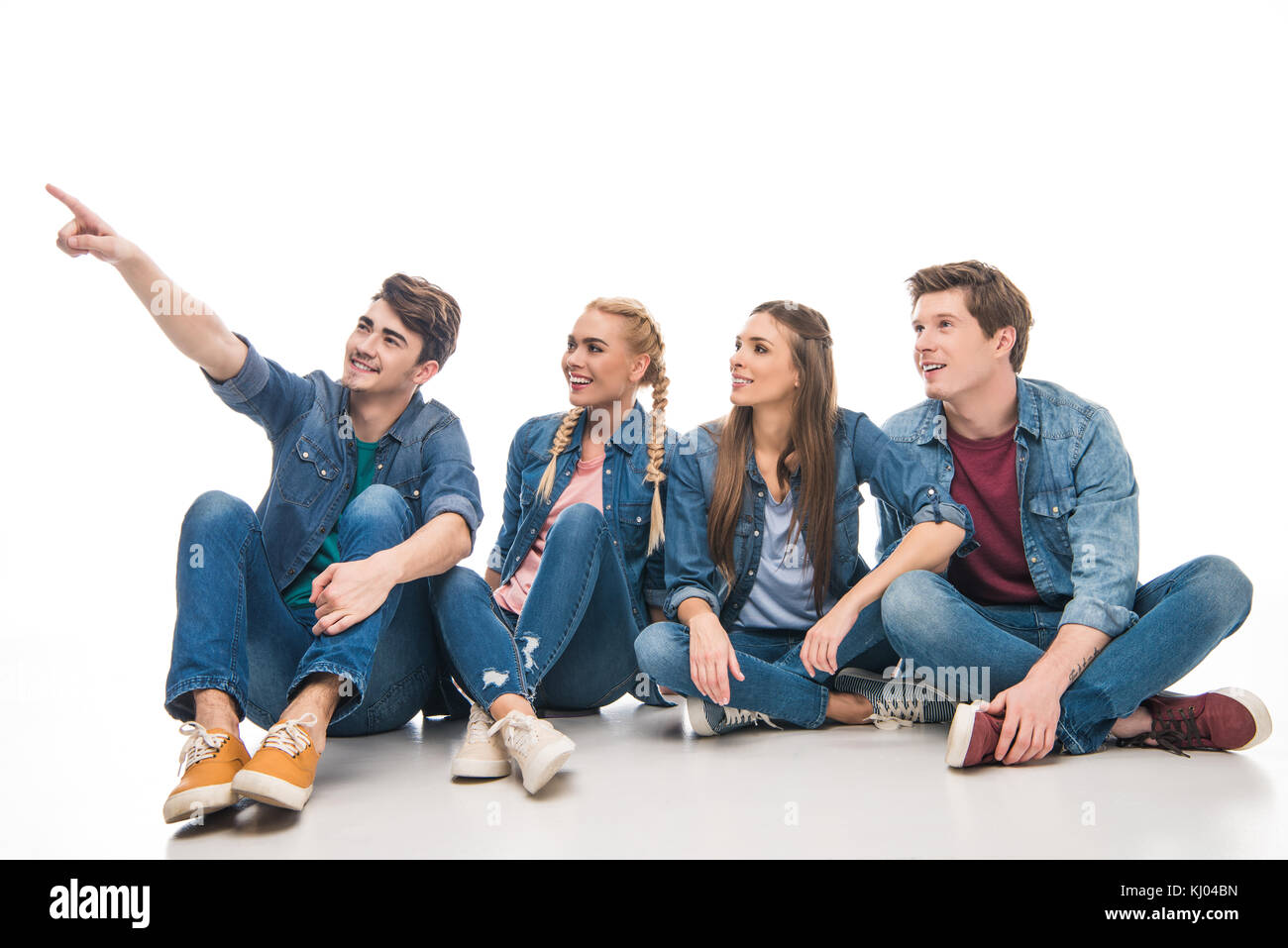 young friends pointing away Stock Photo - Alamy