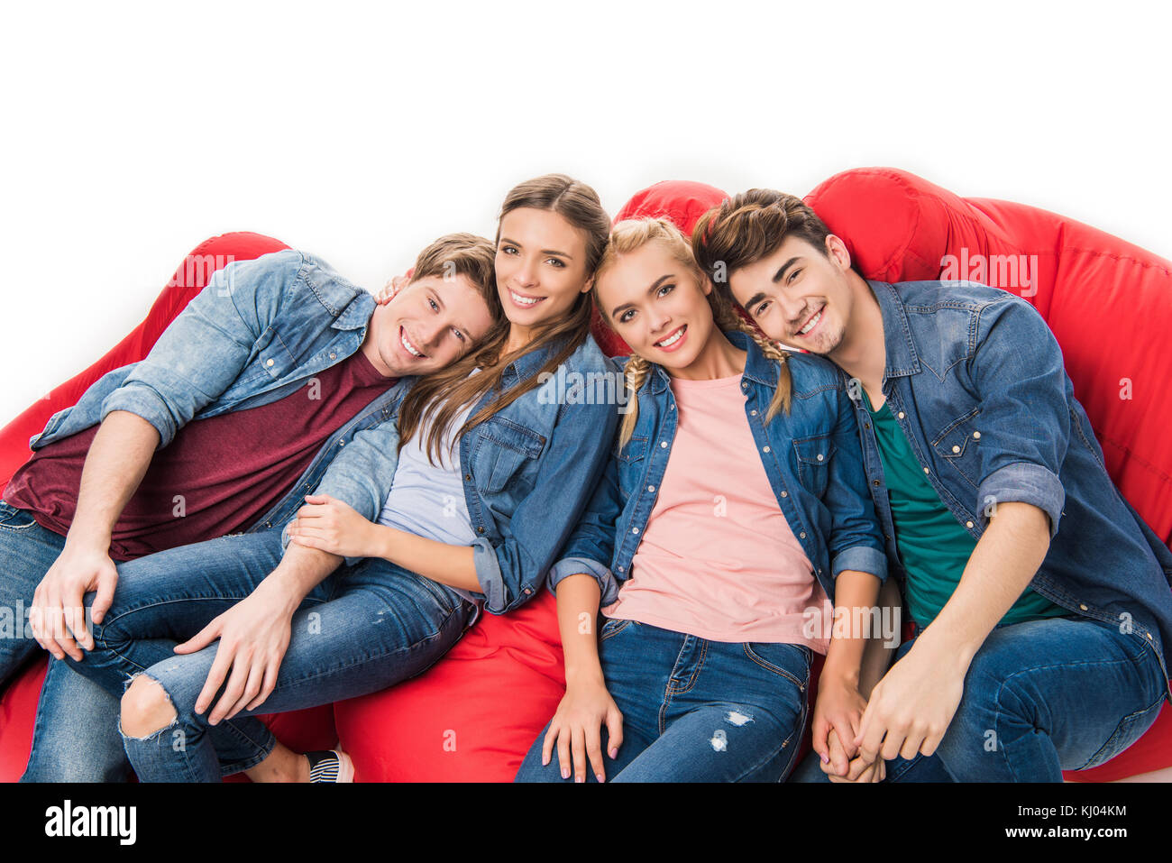 friends sitting on bean bag chairs Stock Photo - Alamy
