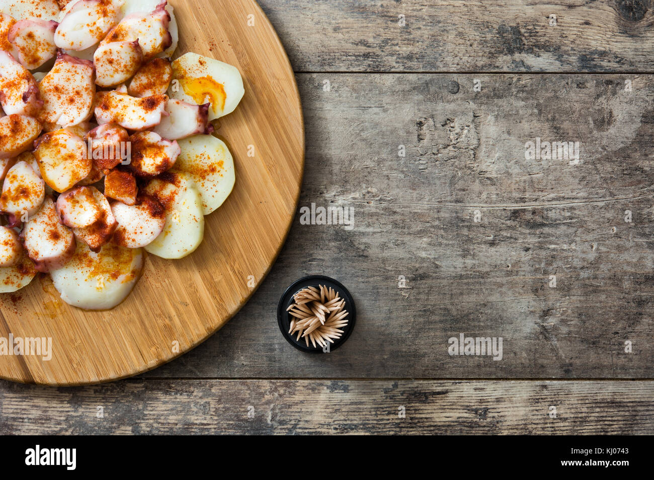 Pulpo a la gallega. Galician octopus on wood. Typical spanish food ...