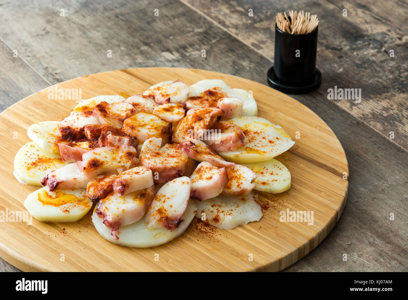 Pulpo a la gallega. Galician octopus on wood. Typical spanish food ...