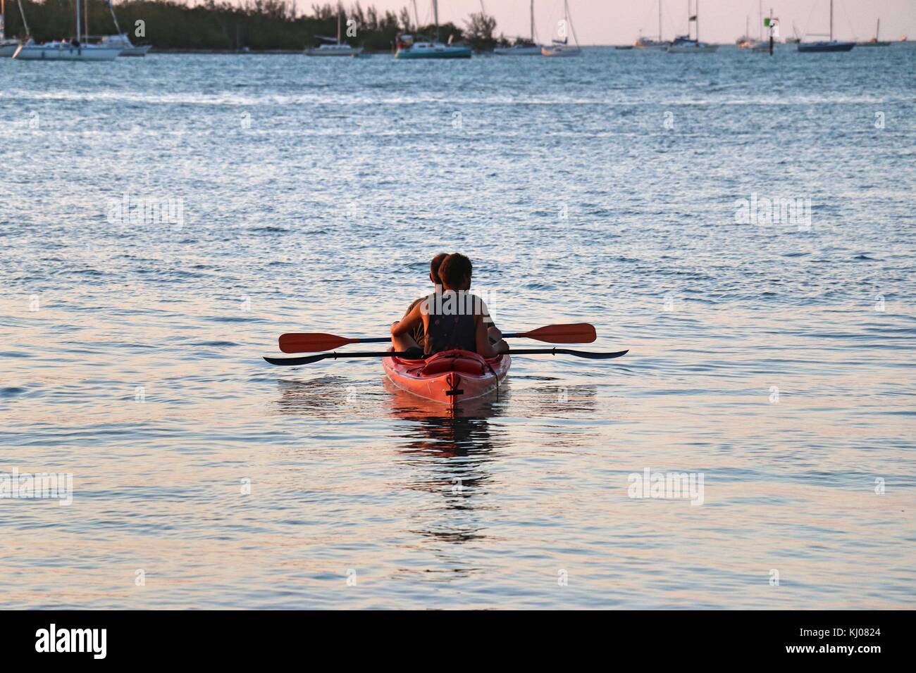 Two men in a canoe Stock Photo - Alamy