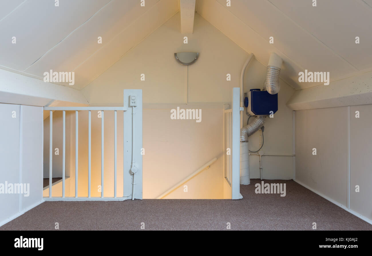 Empty attic room interior - Simple small dutch attic Stock Photo - Alamy
