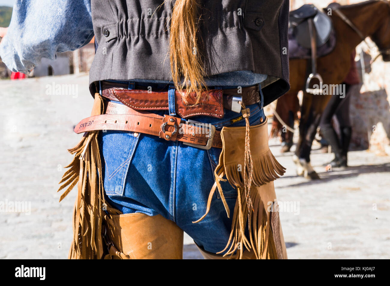 Cowboy saddling horse hi-res stock photography and images - Alamy