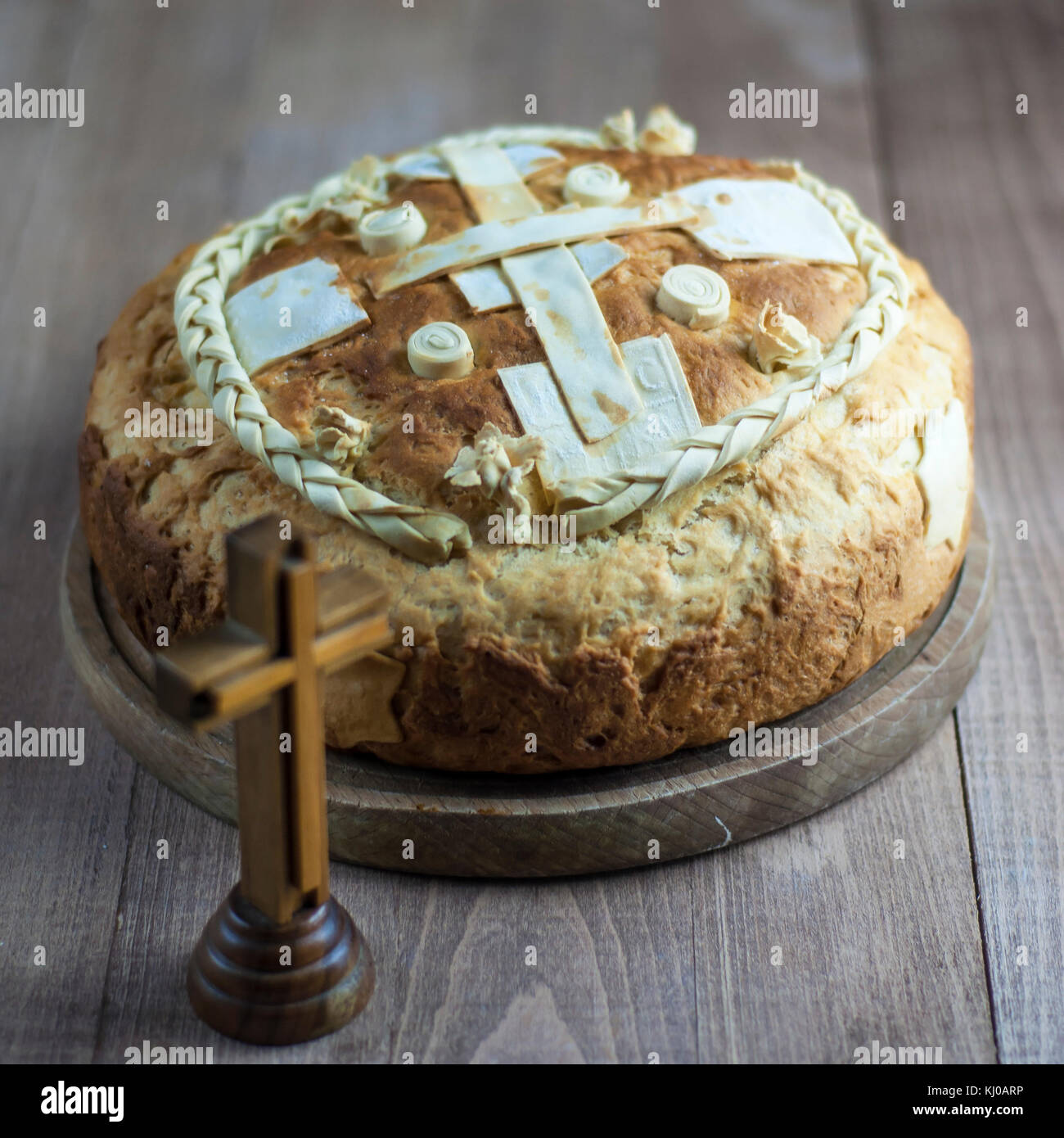 Festive bread and cross on the table Stock Photo - Alamy