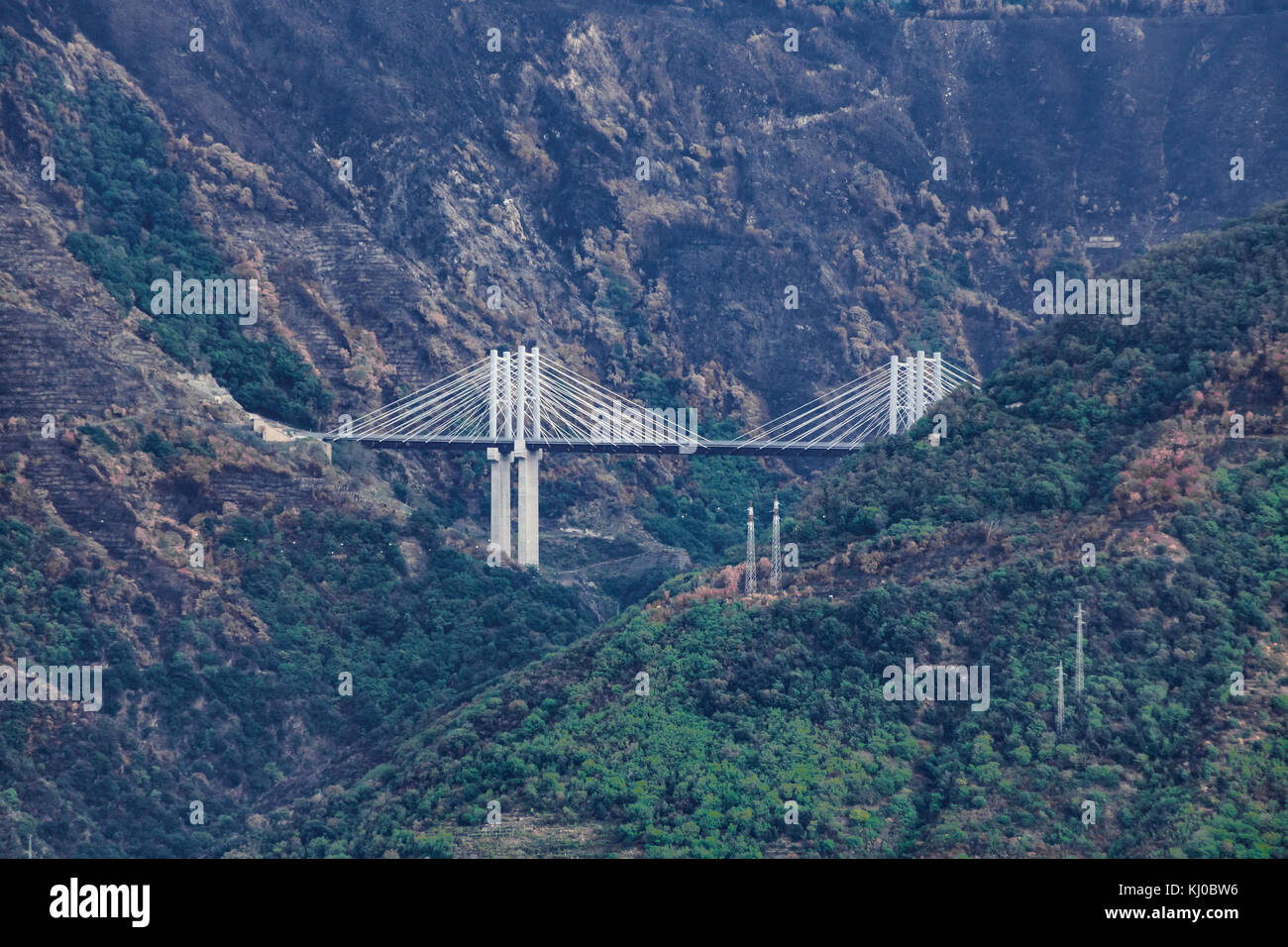 White Suspension Bridge in the Italian Mountains Stock Photo - Alamy