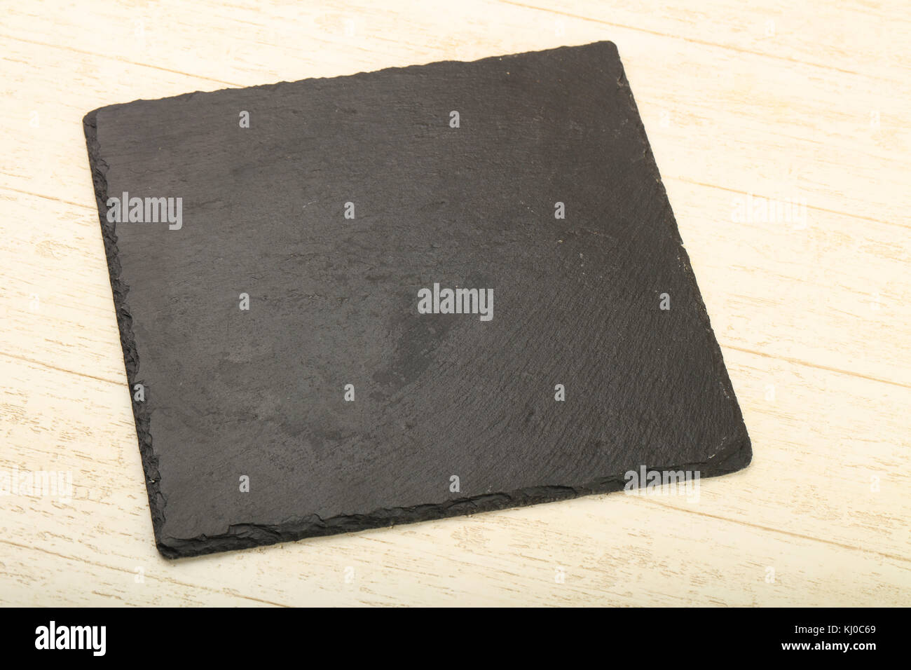 Black stone plate for home and restorant use Stock Photo - Alamy