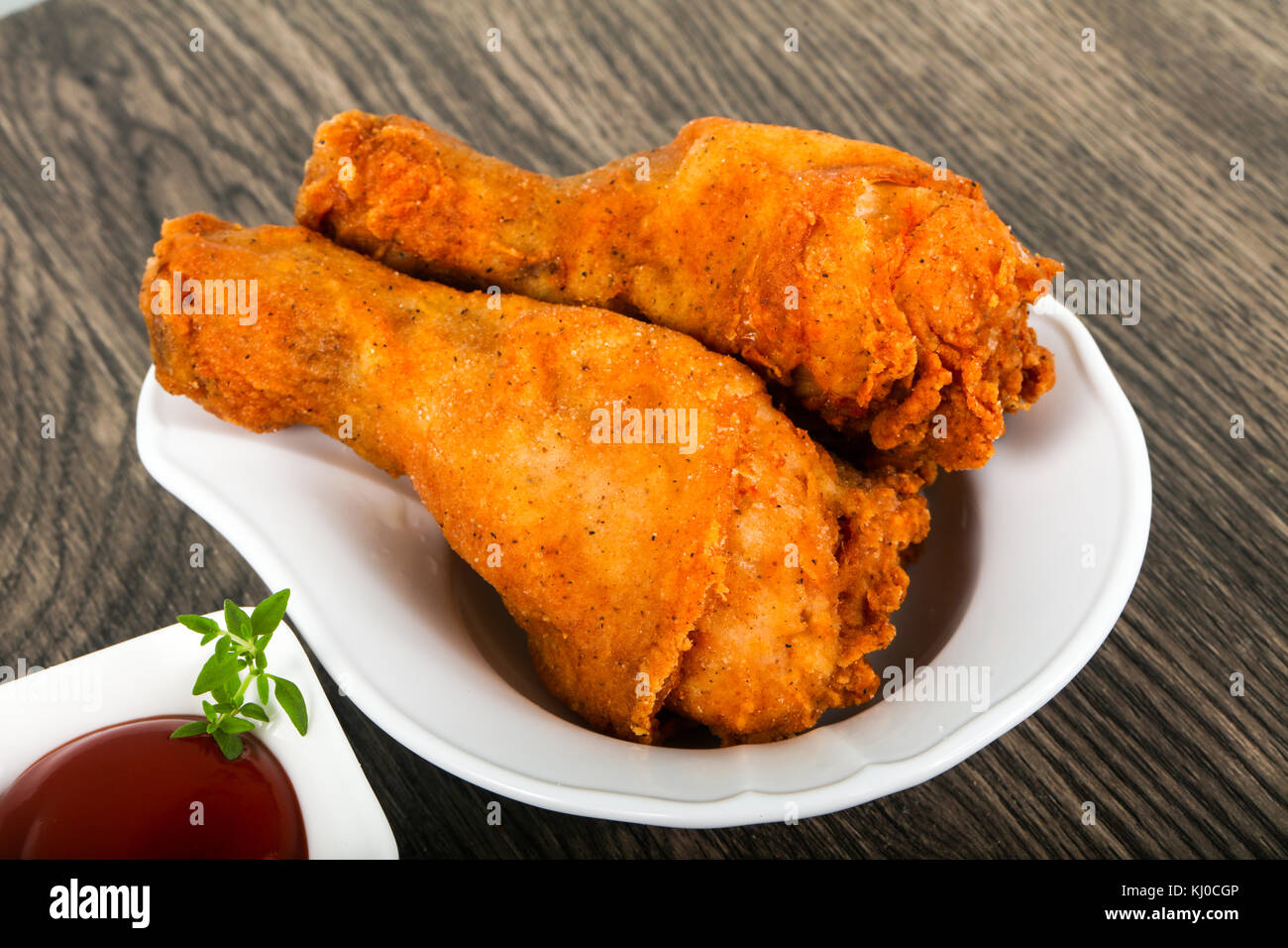 Crispy chicken legs with ketchup Stock Photo - Alamy