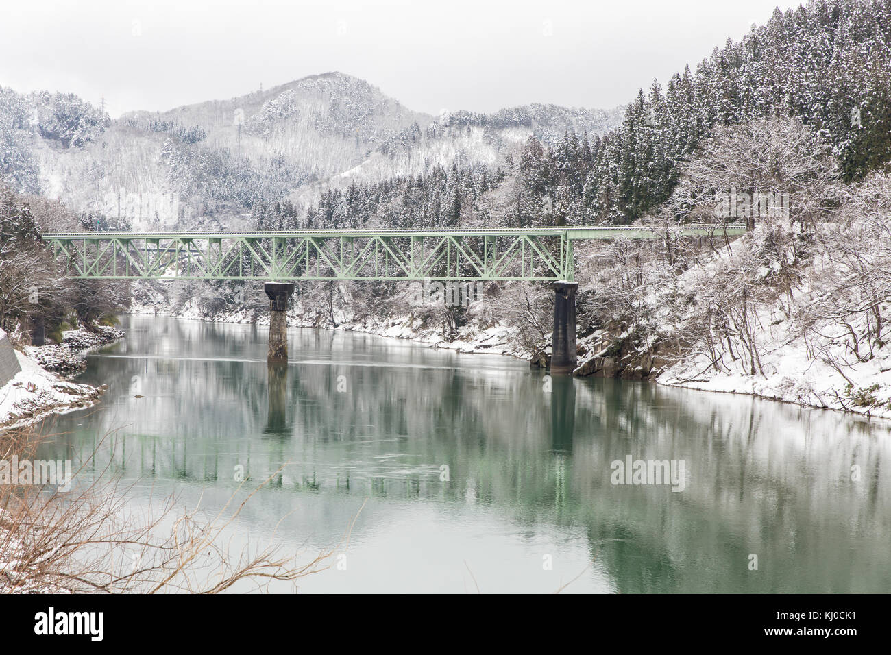 Train in Winter landscape snow on bridge Stock Photo - Alamy