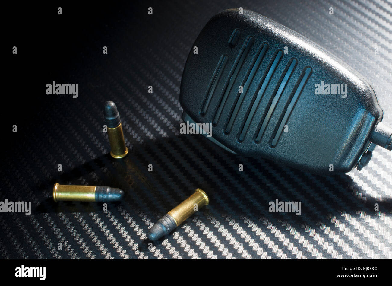 Three rim fire rounds with a police style microphone Stock Photo - Alamy