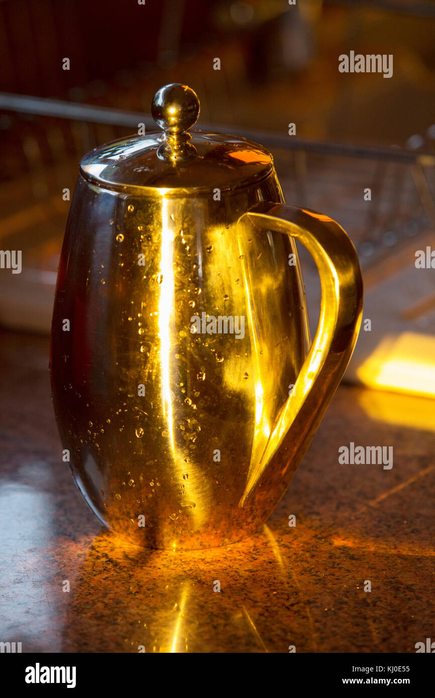Warm evening light on a coffee pot Stock Photo - Alamy