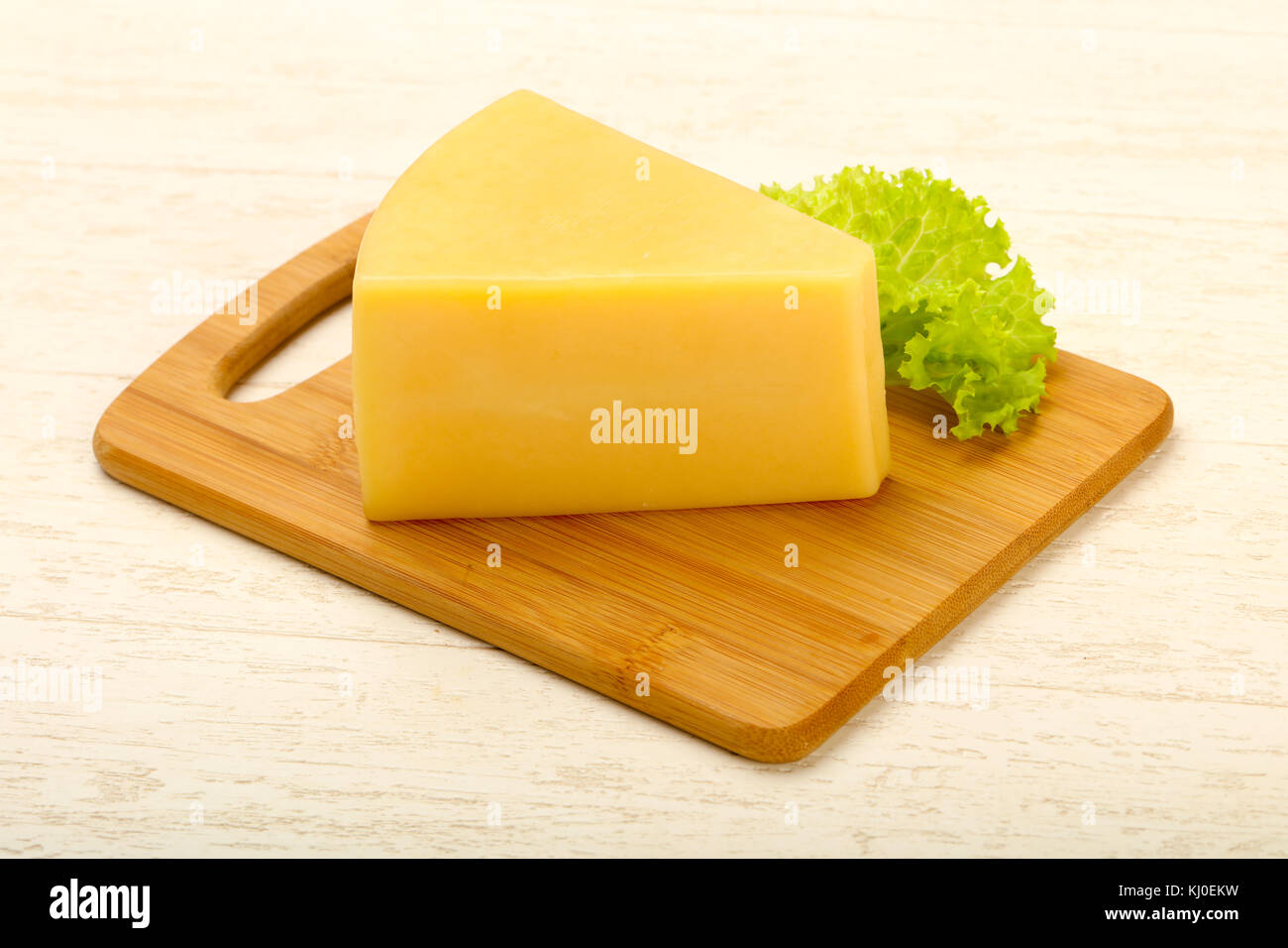 Parmesan cheese triangle Stock Photo - Alamy