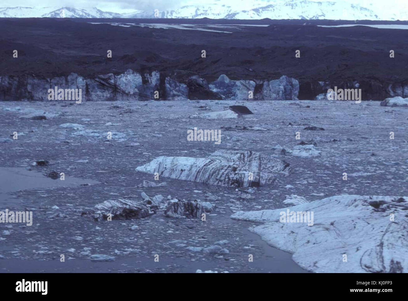 Glacier with ice rocks on ground Stock Photo - Alamy