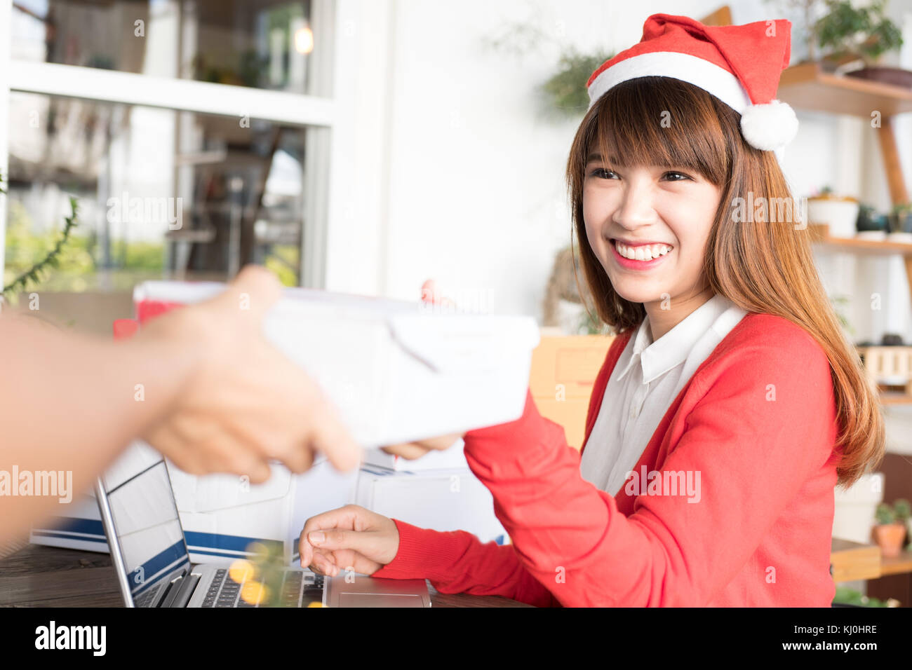 start up small business owner give parcel box to delivery man for ...