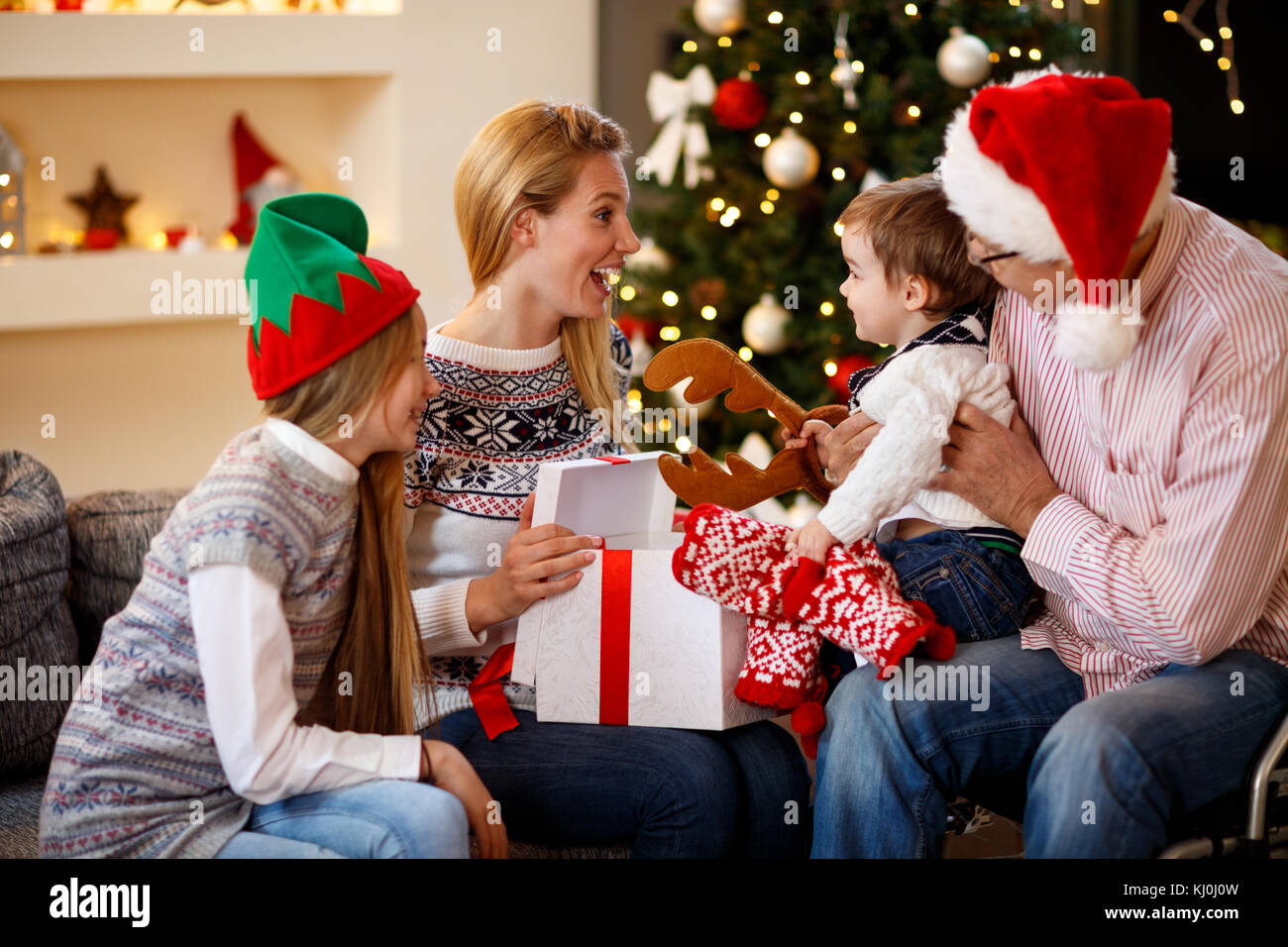 Children having gift surprise from family Stock Photo - Alamy
