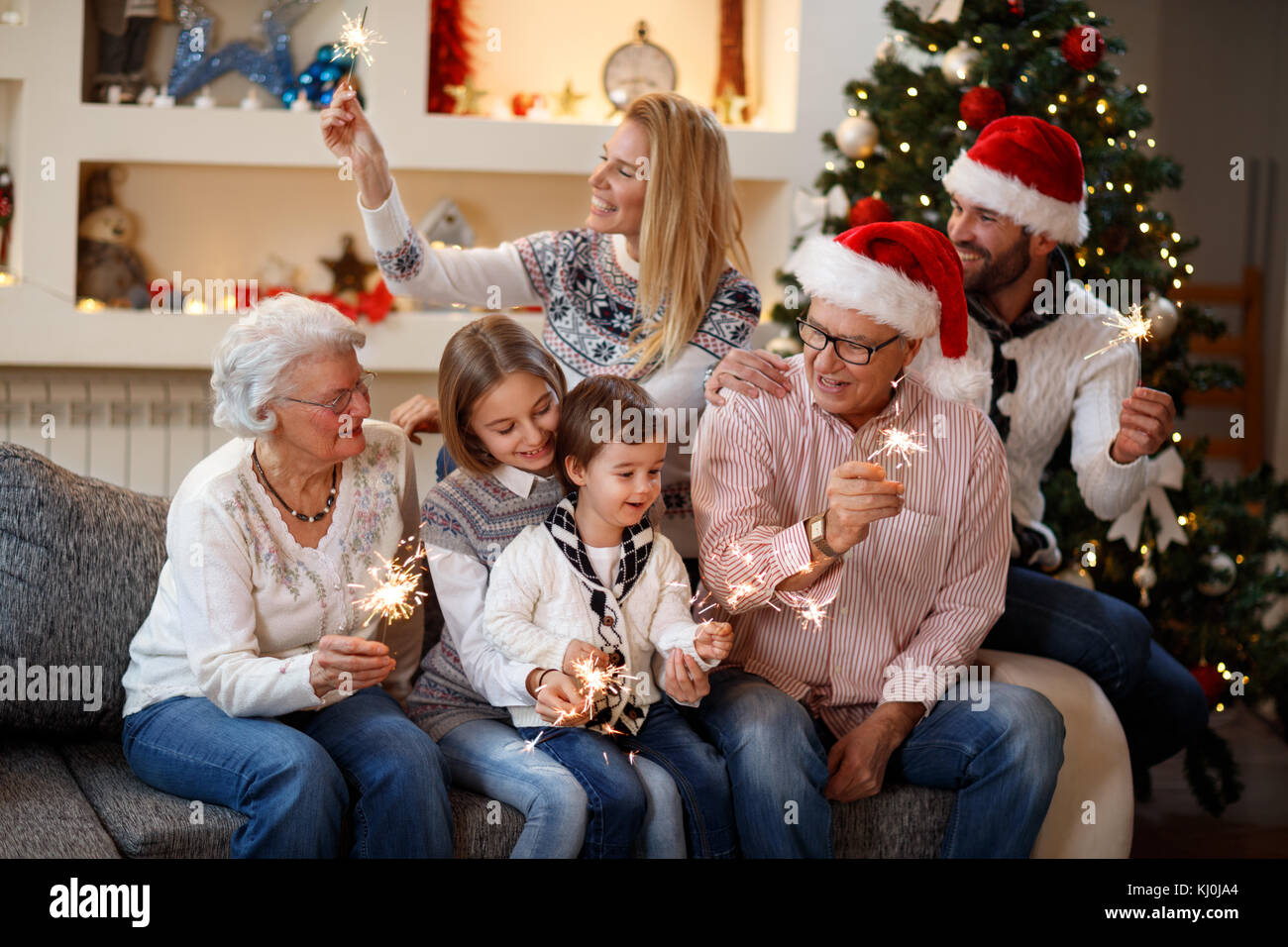 Christmas joy in the family with shiny magic sparkles Stock Photo - Alamy