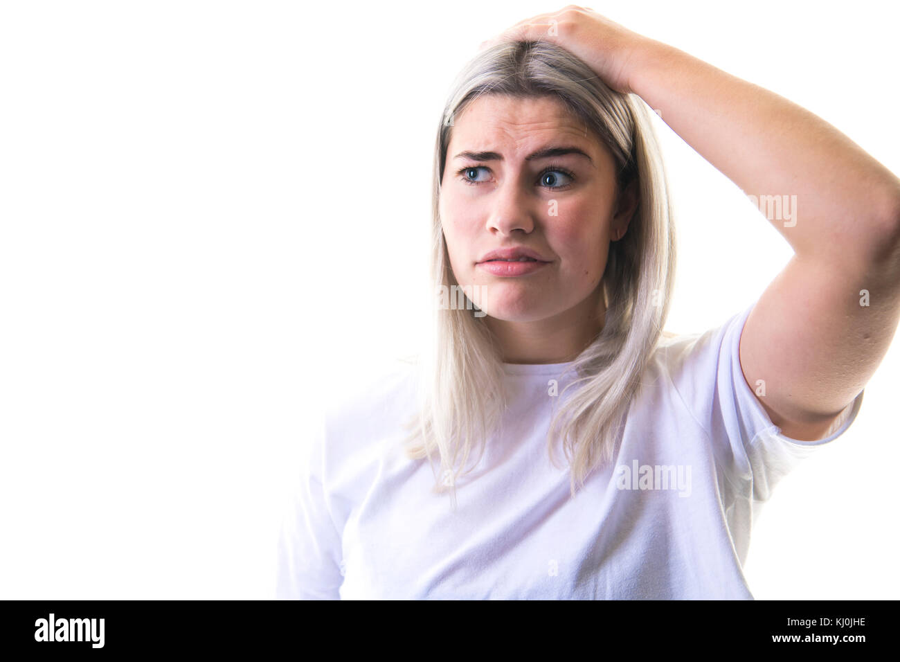 A young teenage girl, 16, 17 years old, looking confused, unsure ...