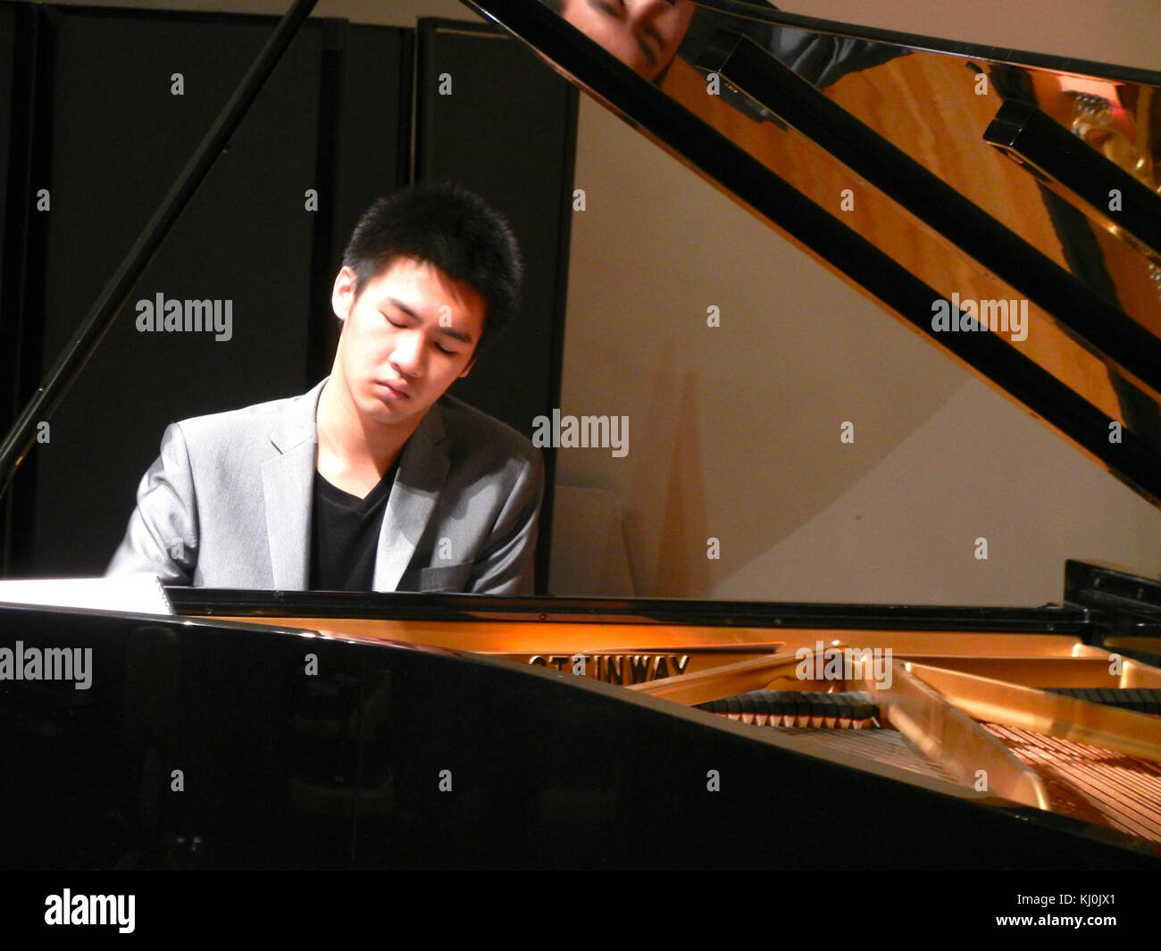 A photograph of Conrad Tao, a renowned pianist and composer, taken in ...