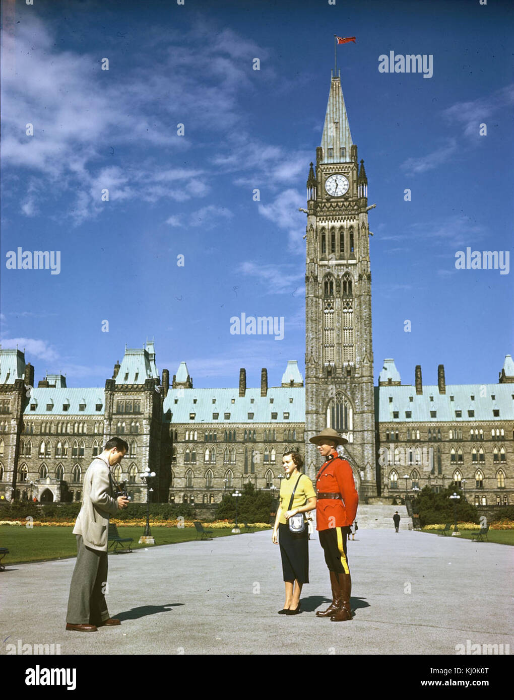 A member of the RCMP poses in front of the Parliament Buildings for ...