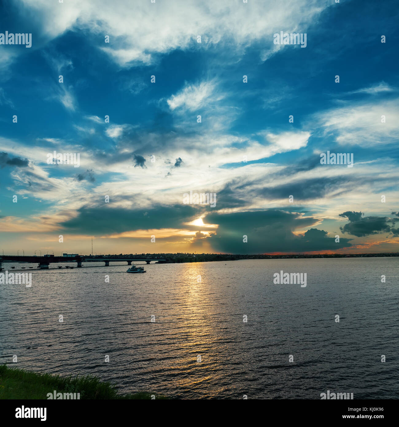 dramatic clouds in sunset over river Stock Photo - Alamy