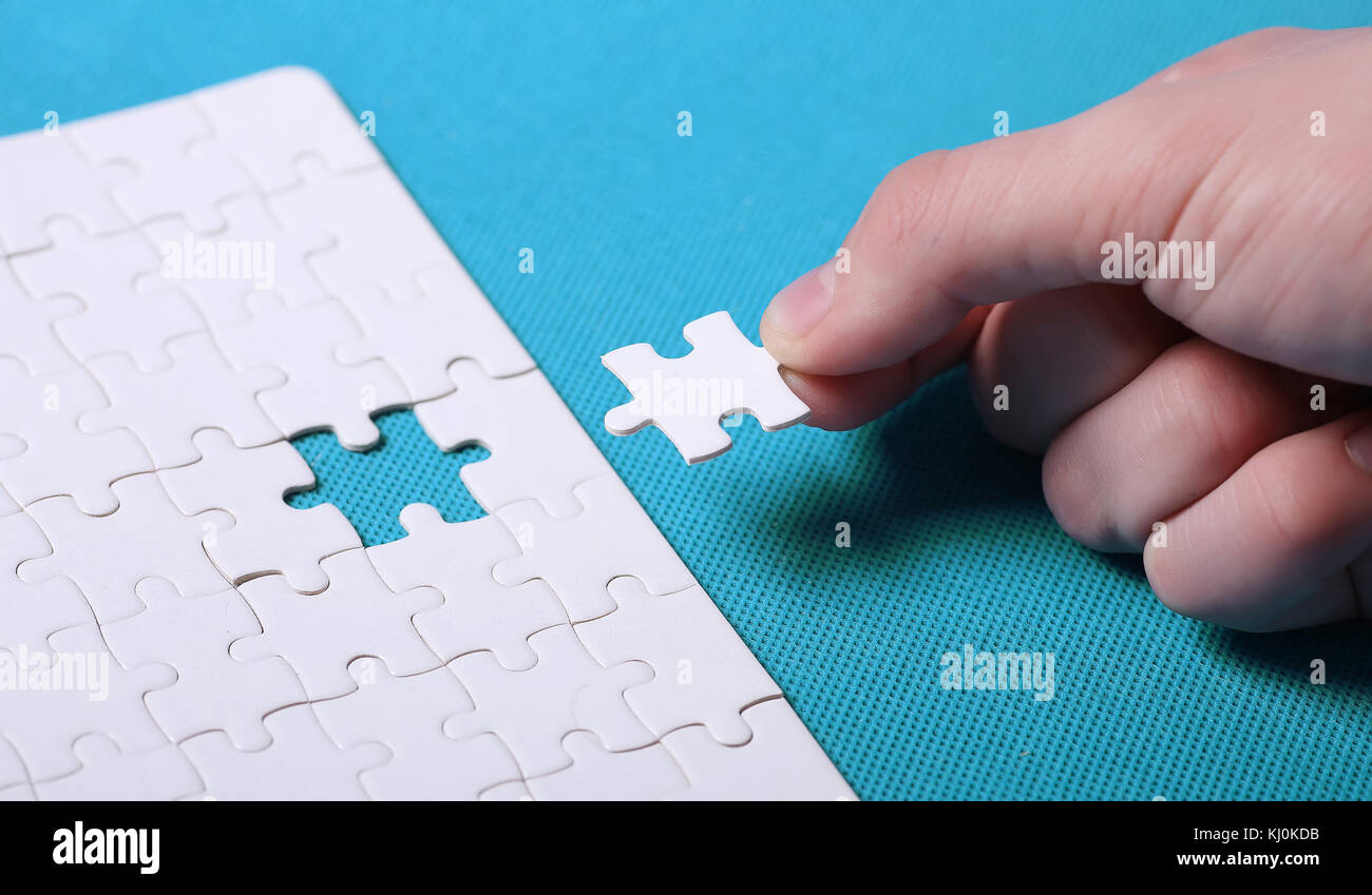 White details of a puzzle on green background. A puzzle is a puz Stock ...