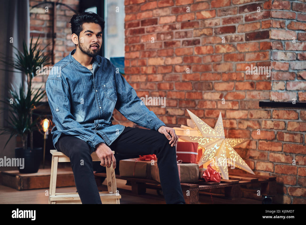 Indian male in the loft room Stock Photo - Alamy