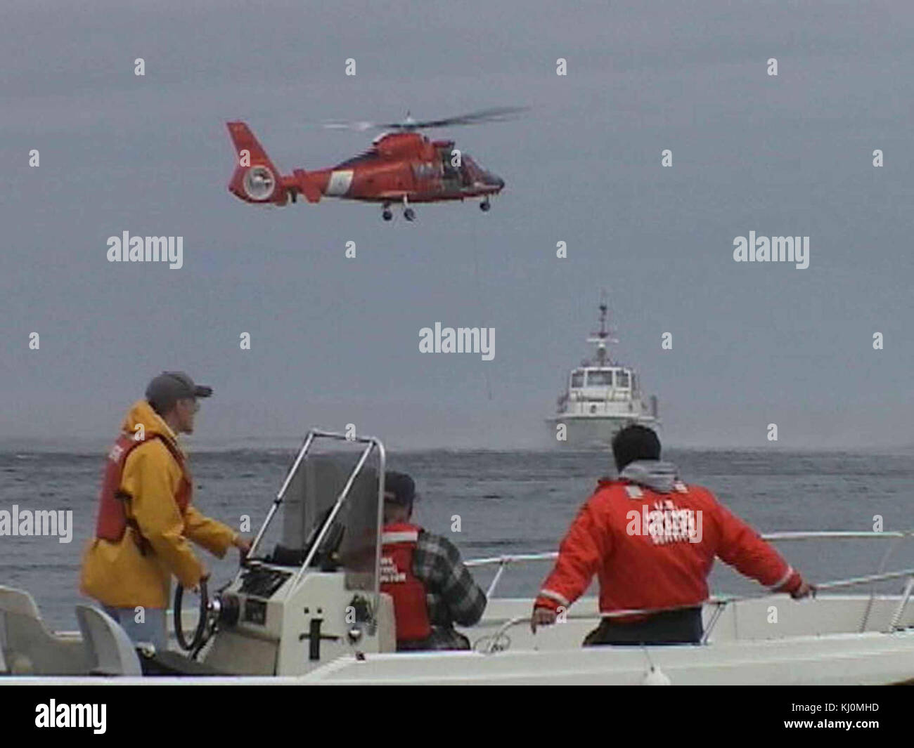 Helicopter and boat rescue operation Stock Photo - Alamy