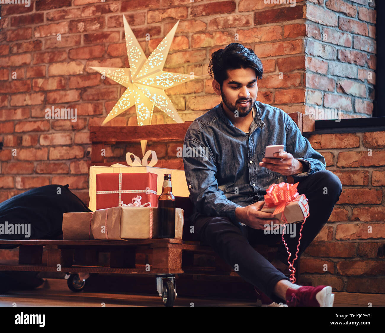 Indian male in a room Stock Photo - Alamy
