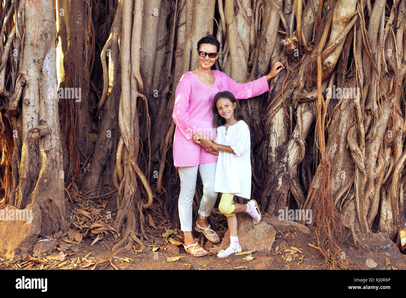 Beautiful girl against tree hi-res stock photography and images - Alamy