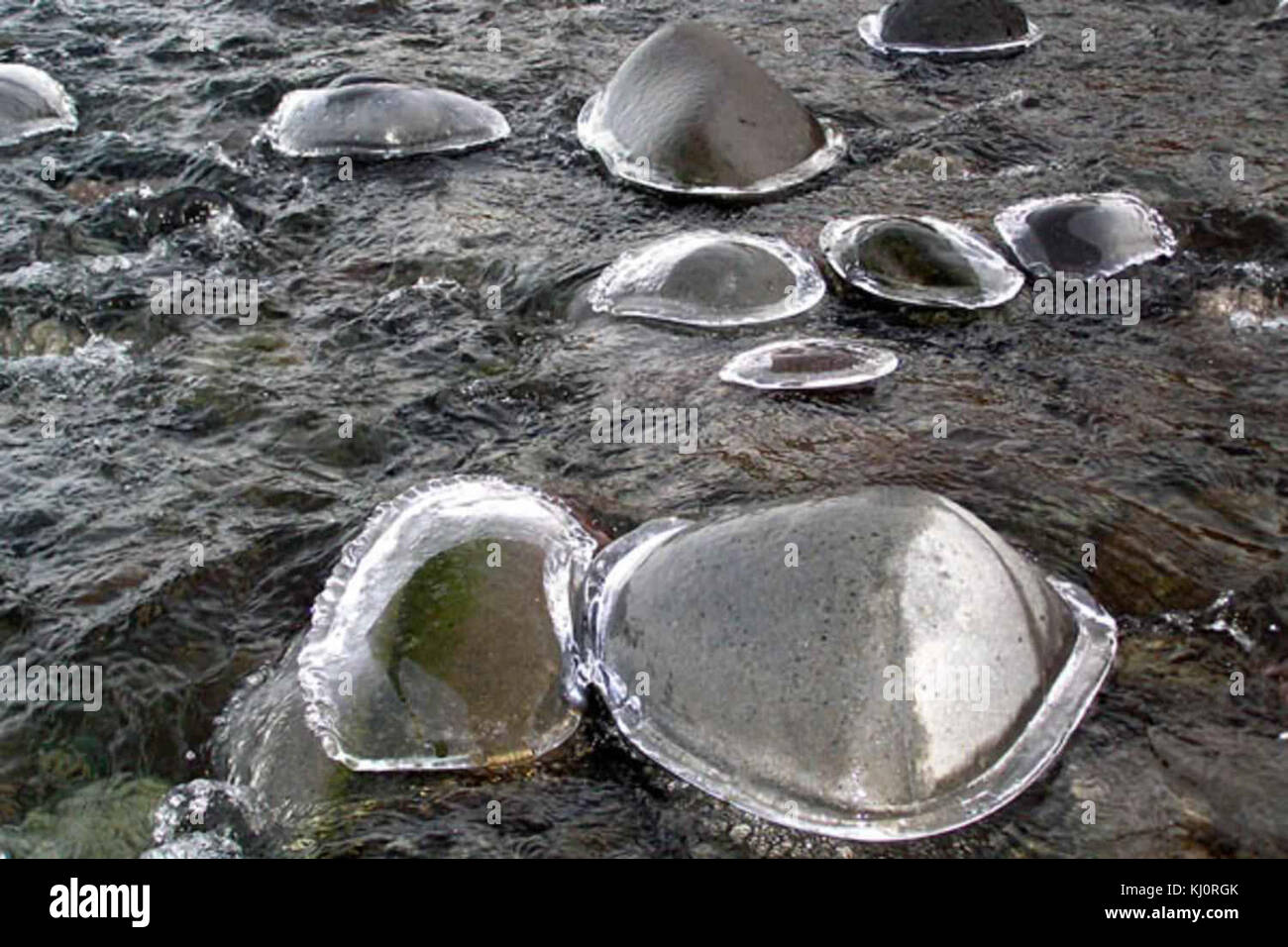 Ice lens on steam rocks Stock Photo - Alamy