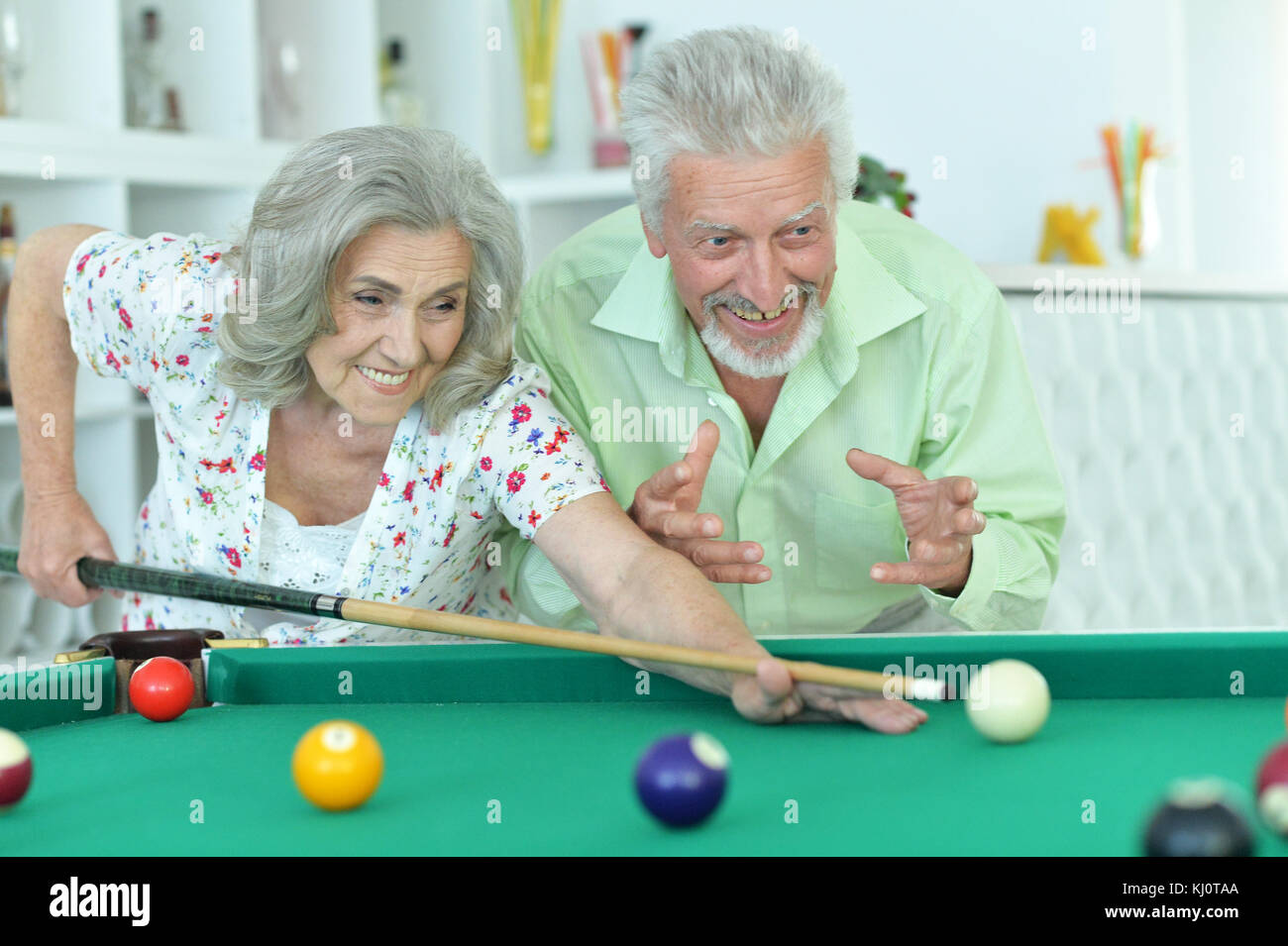 Senior couple playing billiard Stock Photo - Alamy