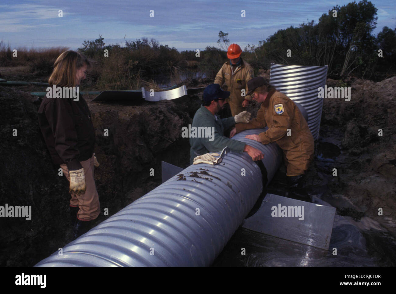 Installing water control pipe Stock Photo - Alamy