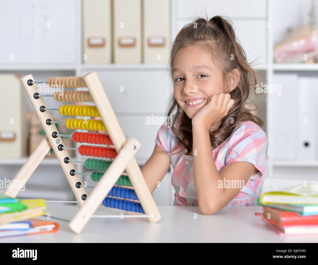 little girl counting on abacus Stock Photo - Alamy