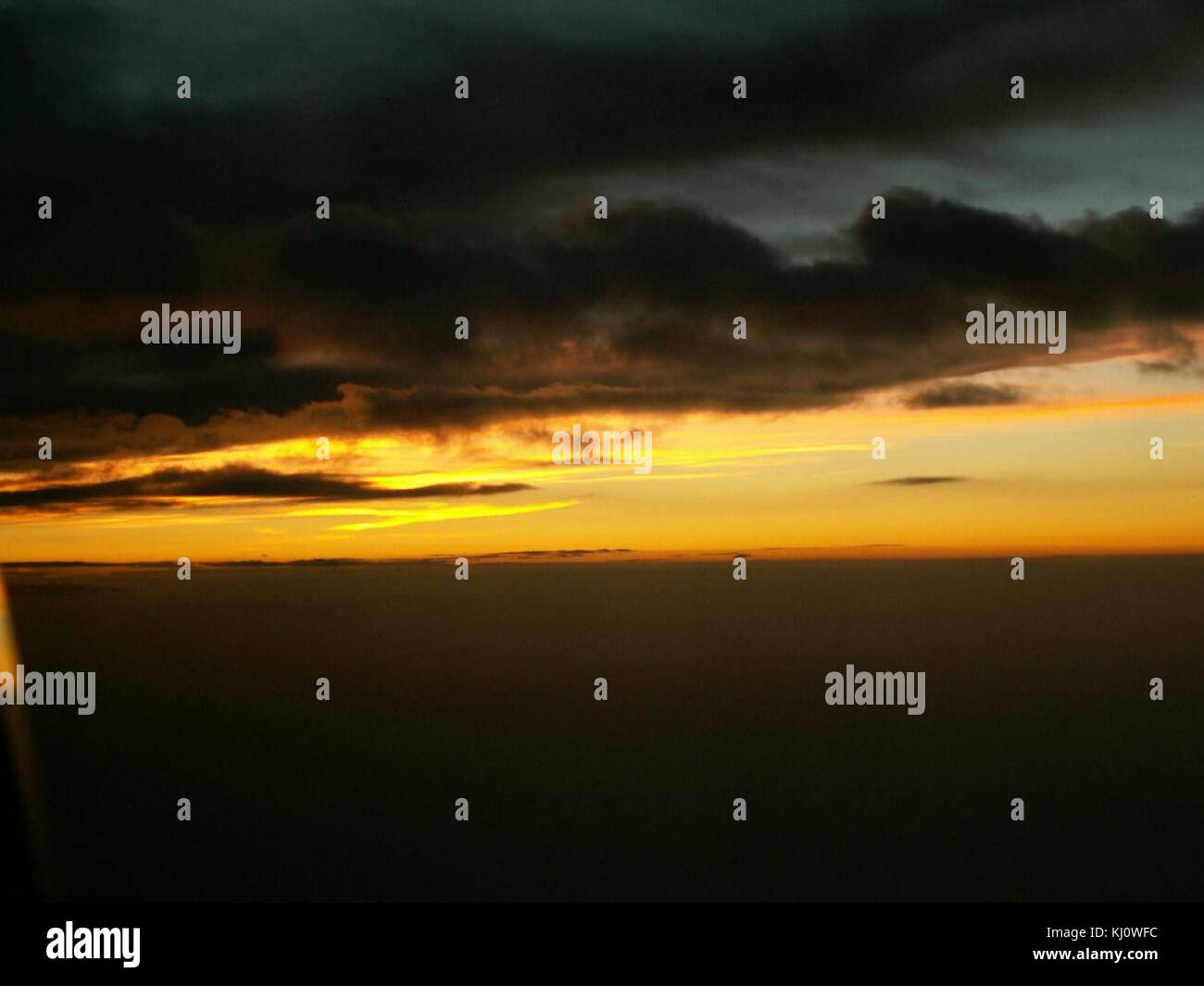 Dark clouds at sunset Stock Photo - Alamy