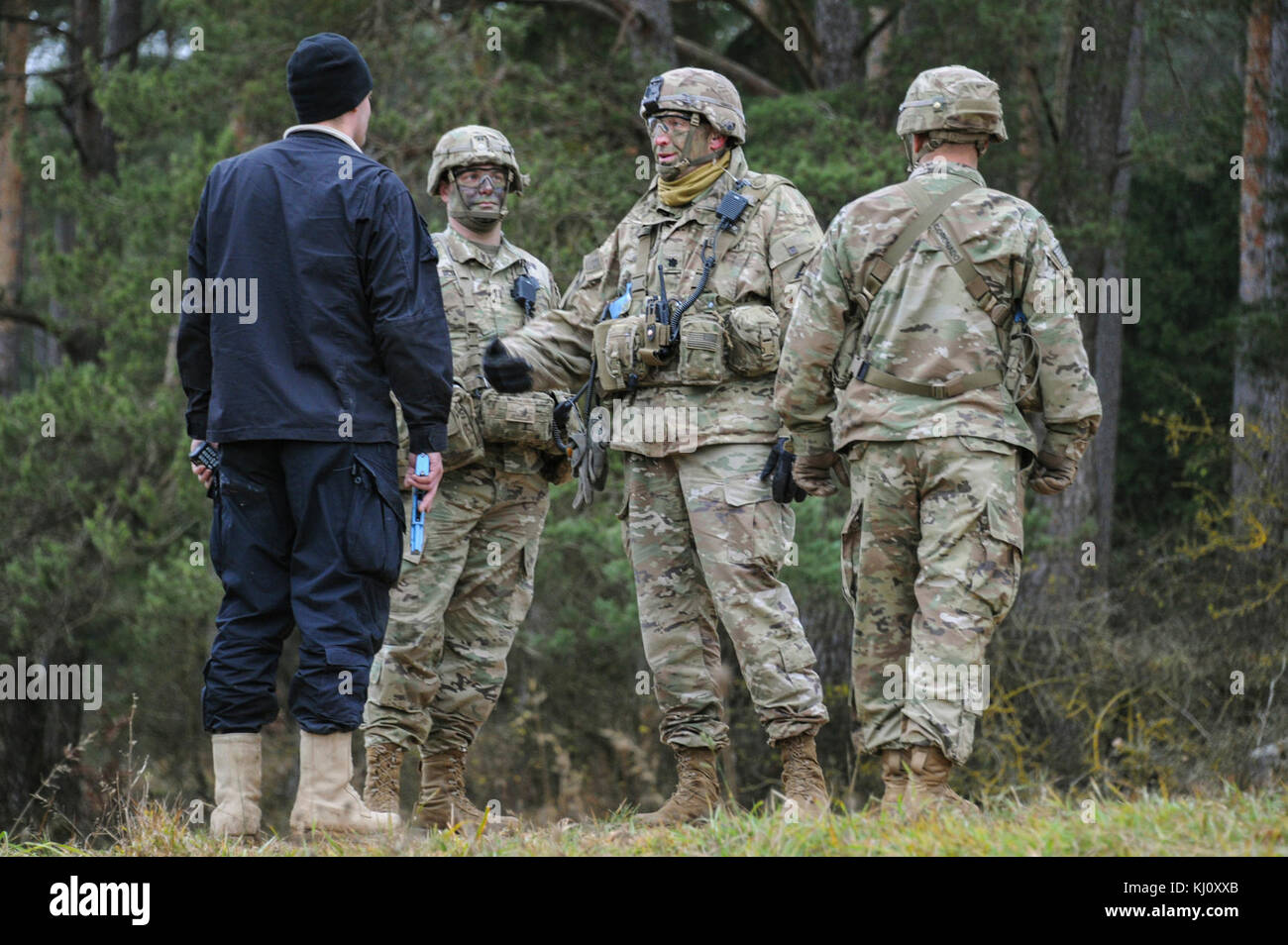 U.S. Army Lt. Col. Steven Gventer, center, with the Grizzly Observer ...