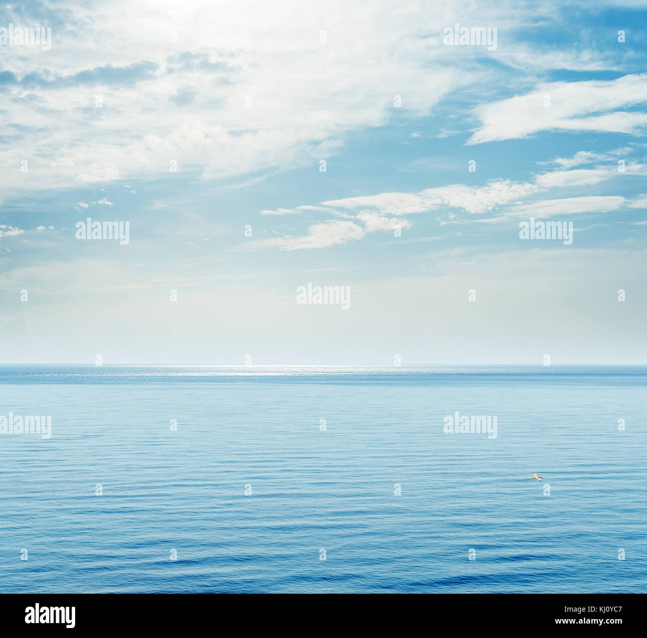 blue sea and clouds in sky over it Stock Photo - Alamy