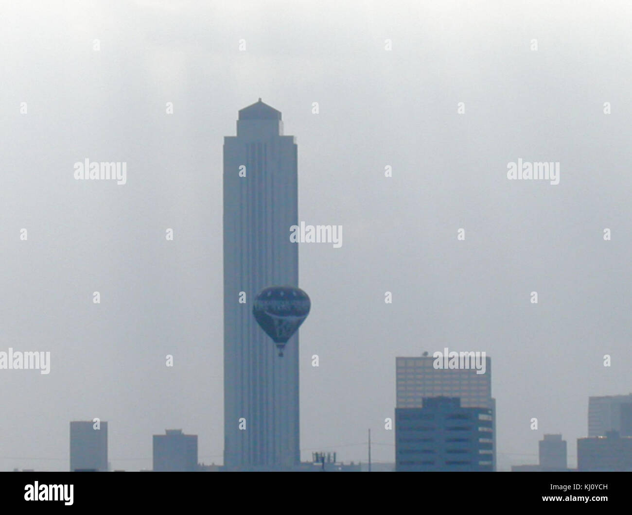 Hot air balloon passing by williams energy tower Stock Photo - Alamy